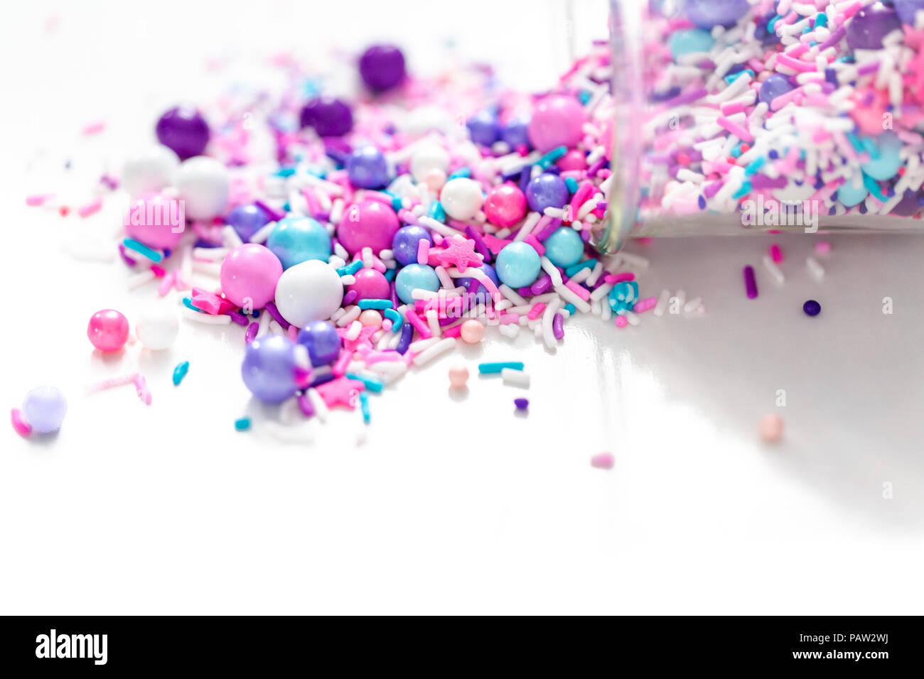 Colorful purple sprinkle blend on a white background Stock Photo - Alamy