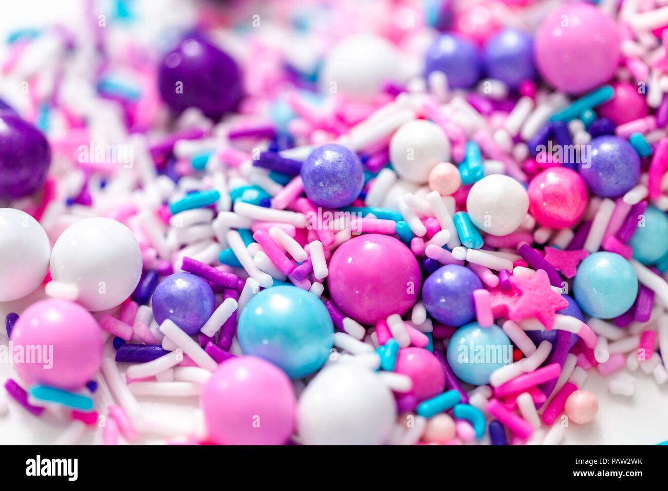 Colorful purple sprinkle blend on a white background Stock Photo - Alamy