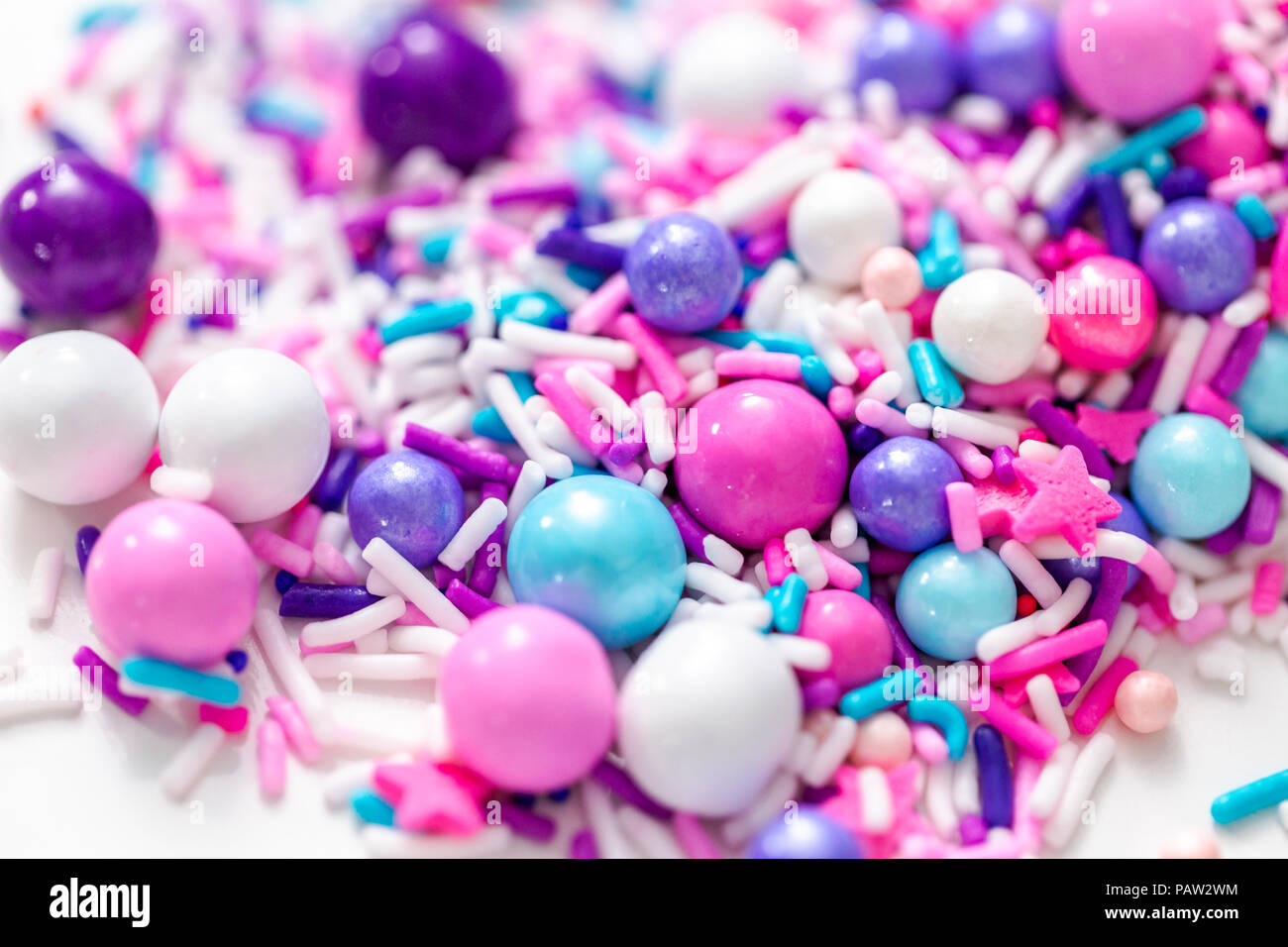 Colorful purple sprinkle blend on a white background Stock Photo - Alamy
