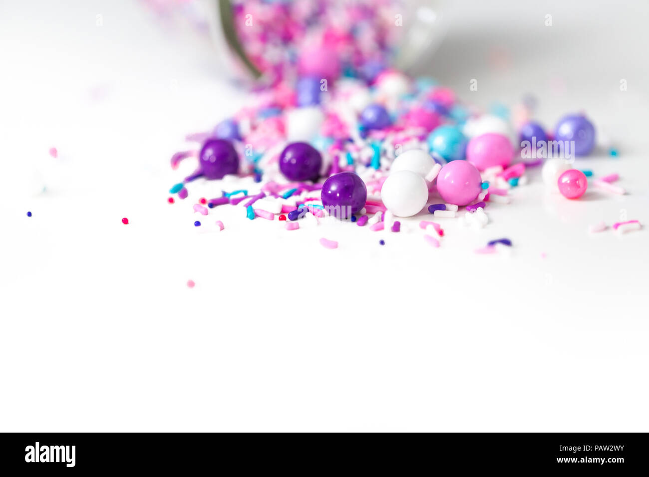 Colorful purple sprinkle blend on a white background Stock Photo - Alamy