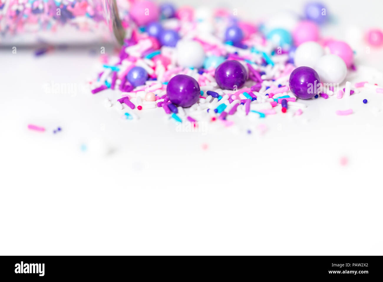 Colorful purple sprinkle blend on a white background Stock Photo - Alamy