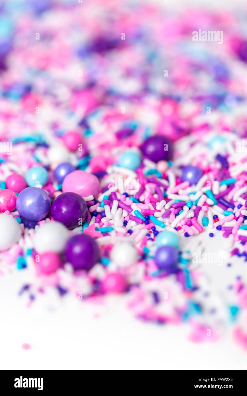 Colorful purple sprinkle blend on a white background Stock Photo - Alamy