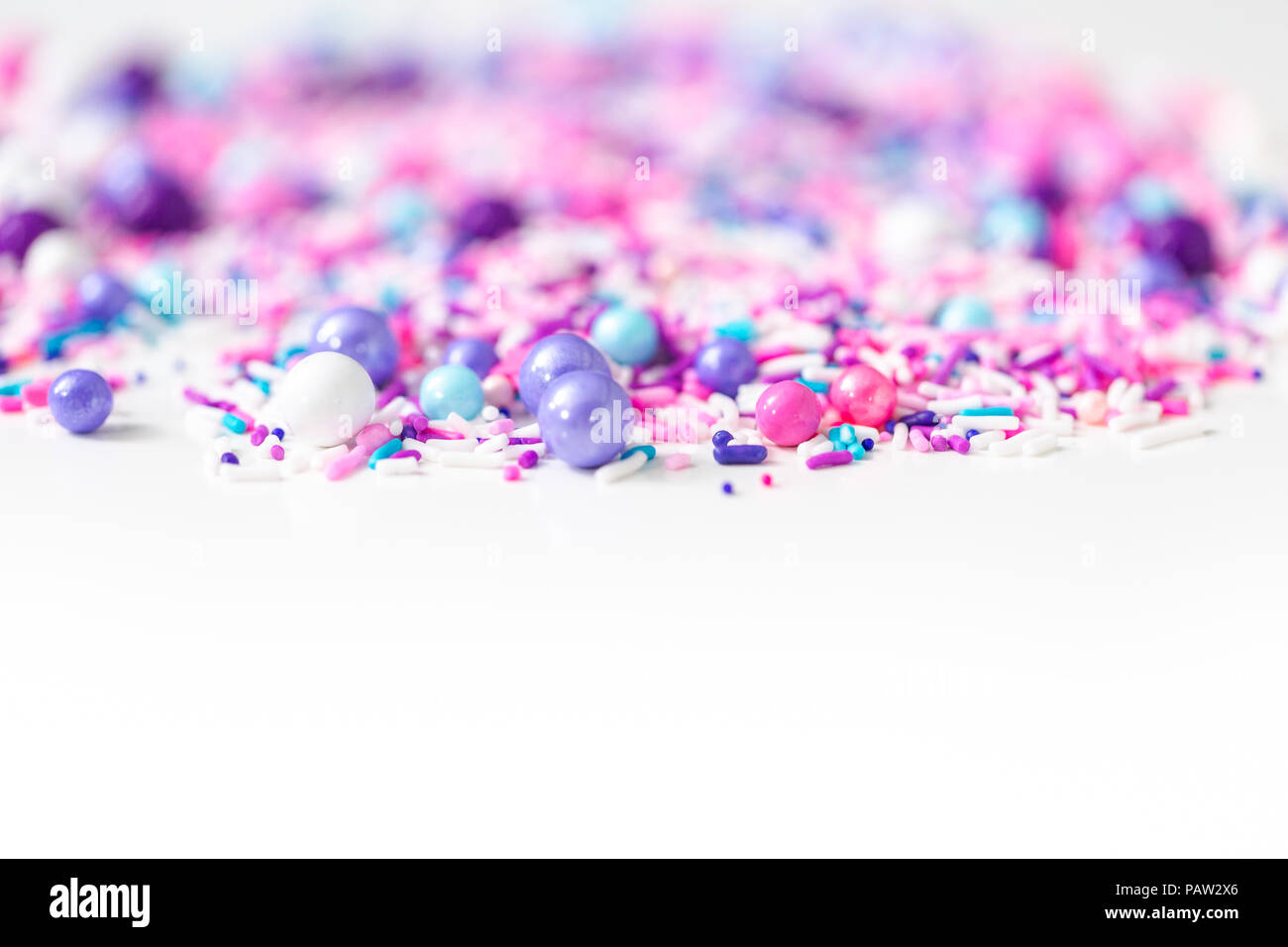 Colorful purple sprinkle blend on a white background Stock Photo - Alamy