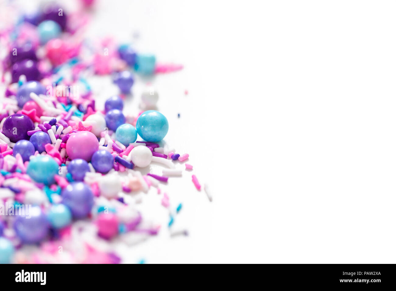 Colorful purple sprinkle blend on a white background Stock Photo - Alamy