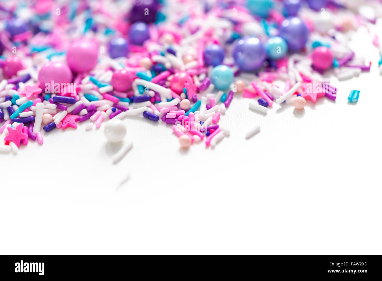 Colorful purple sprinkle blend on a white background Stock Photo - Alamy