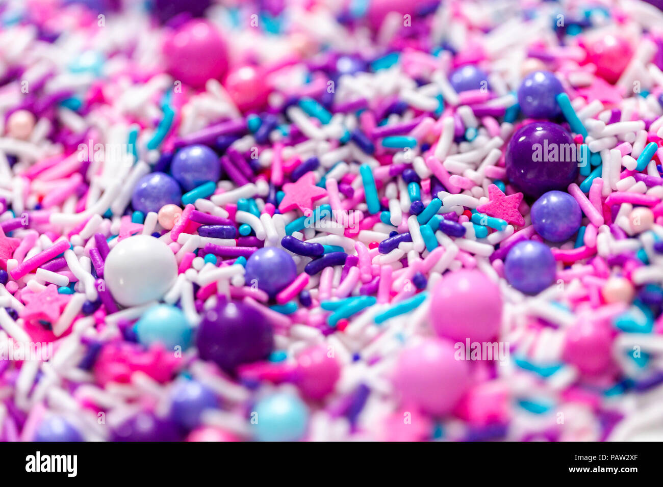 Colorful purple sprinkle blend on a white background Stock Photo - Alamy