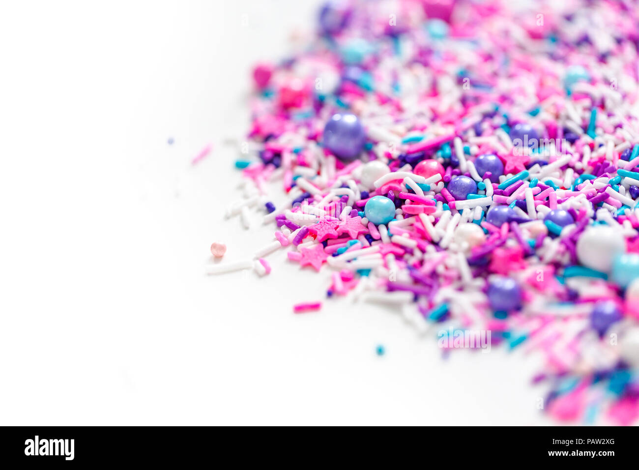 Colorful purple sprinkle blend on a white background Stock Photo - Alamy