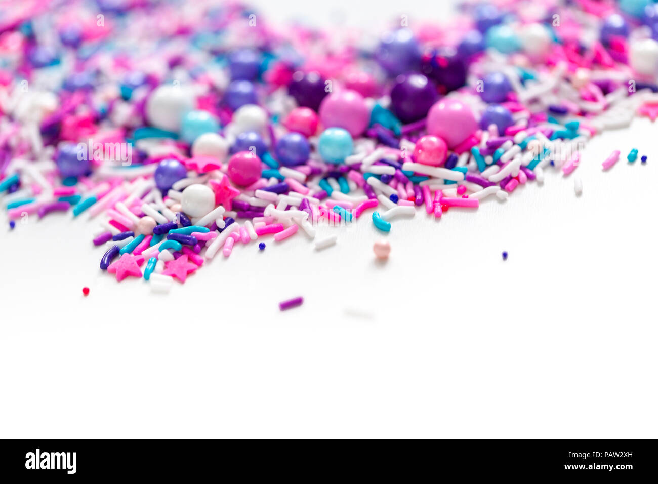 Colorful purple sprinkle blend on a white background Stock Photo - Alamy
