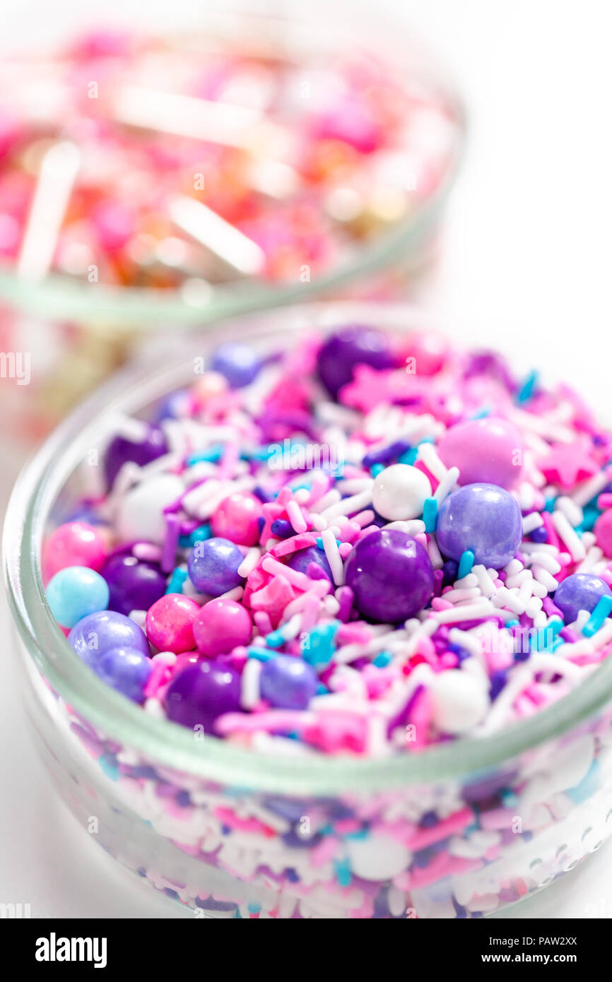 Colorful purple sprinkle blend on a white background Stock Photo - Alamy