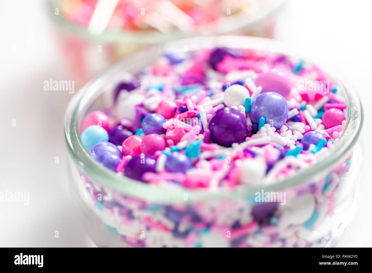 Colorful purple sprinkle blend on a white background Stock Photo - Alamy