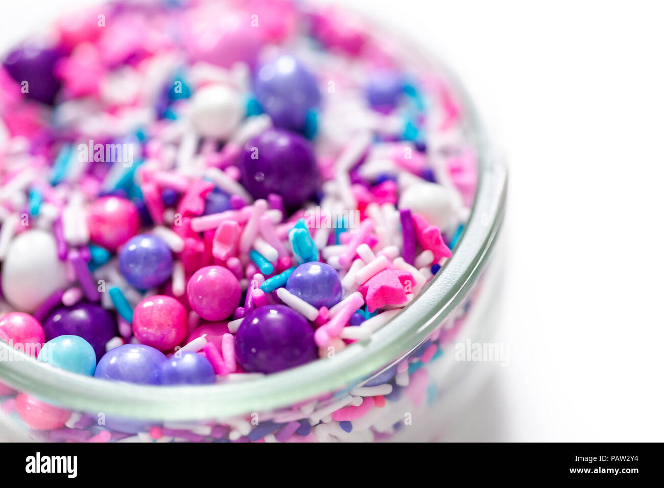 Colorful purple sprinkle blend on a white background Stock Photo - Alamy