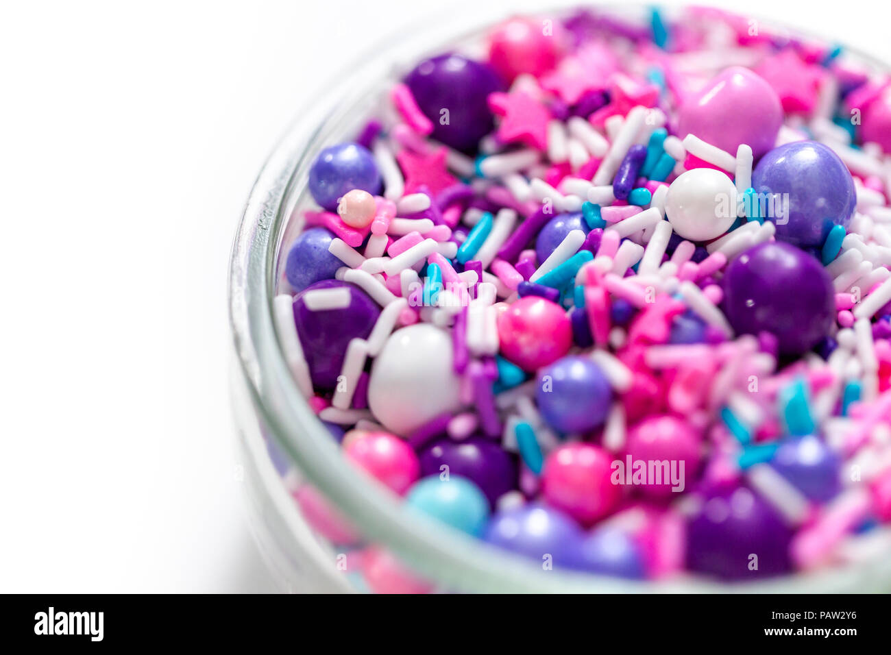 Colorful purple sprinkle blend on a white background Stock Photo - Alamy