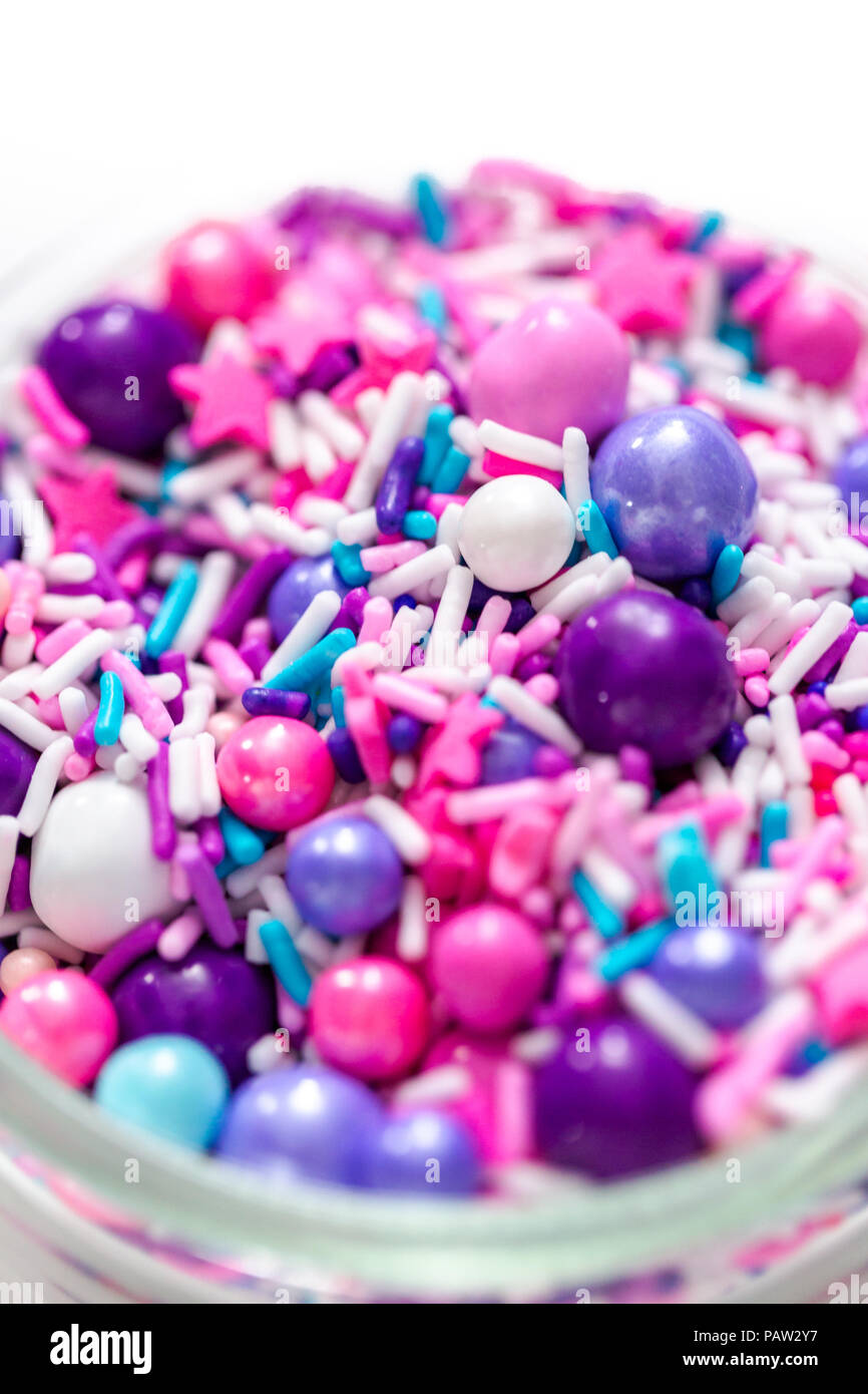 Colorful purple sprinkle blend on a white background Stock Photo - Alamy