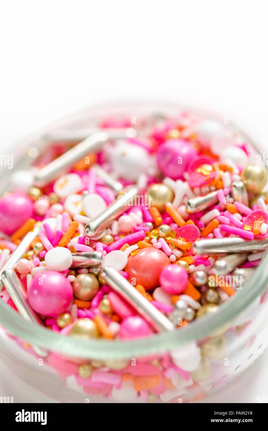 Colorful pink sprinkle blend on a white background Stock Photo - Alamy