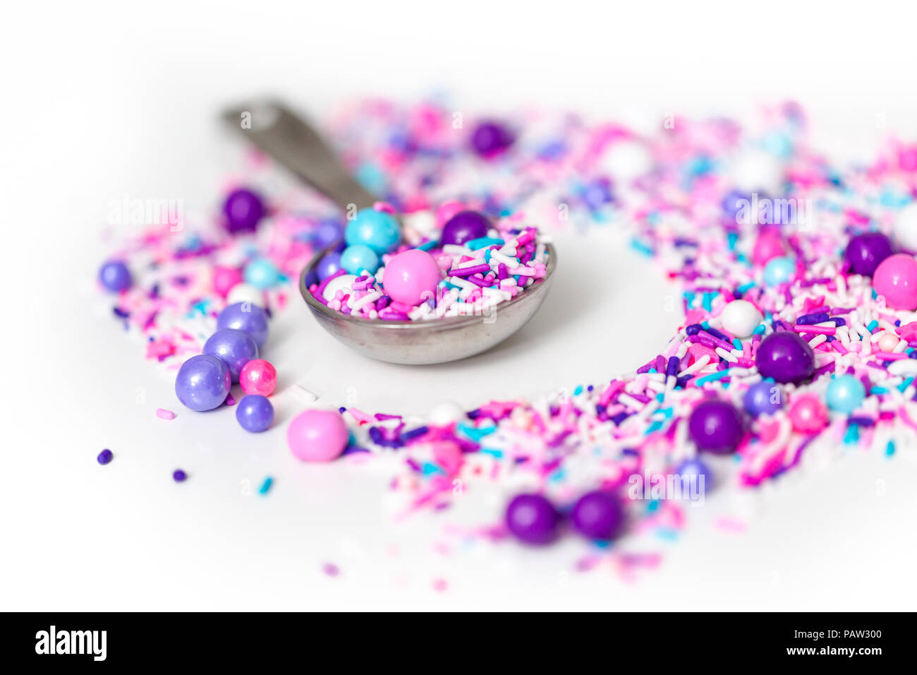 Colorful purple sprinkle blend on a white background Stock Photo - Alamy