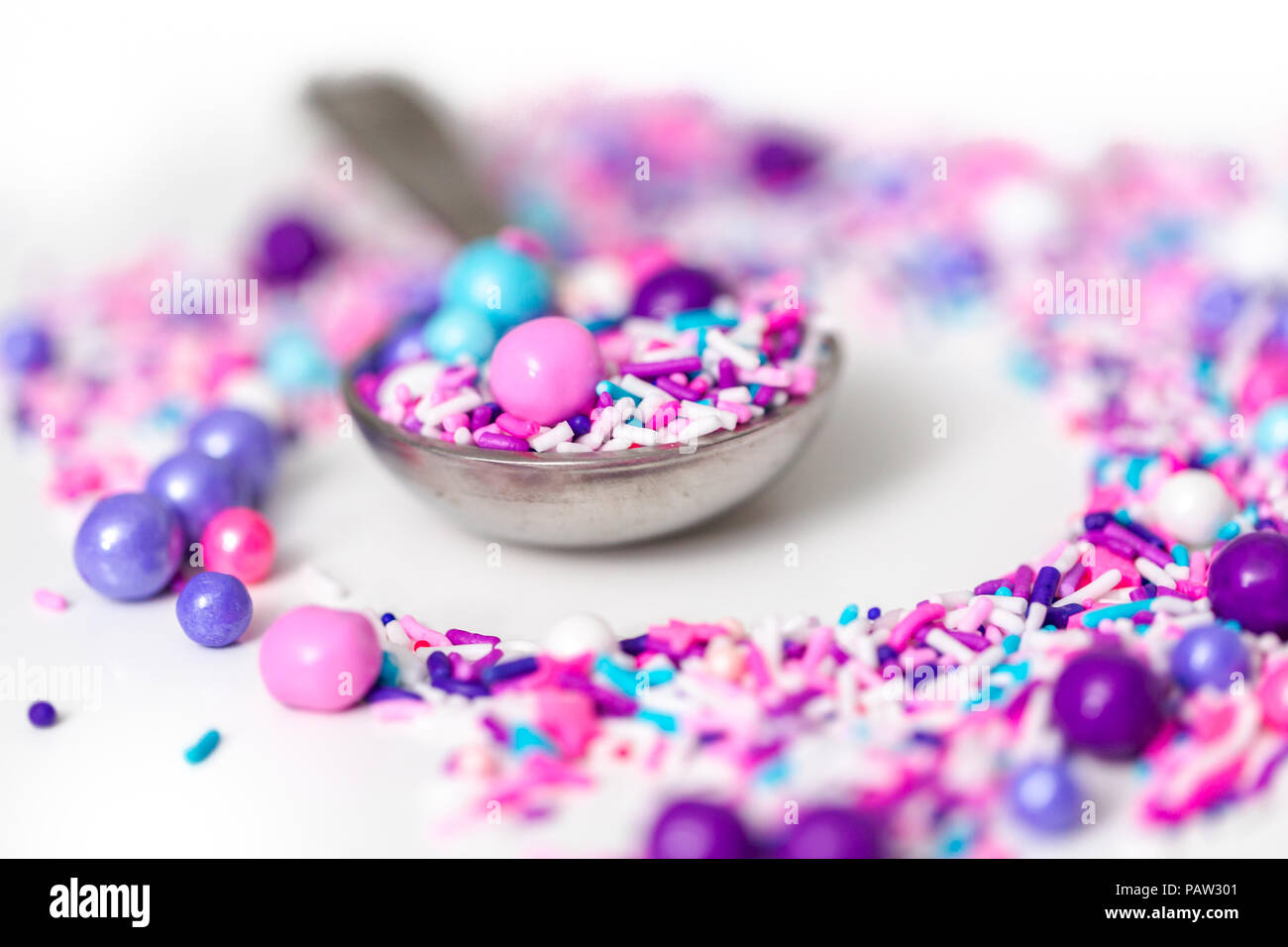 Colorful purple sprinkle blend on a white background Stock Photo - Alamy