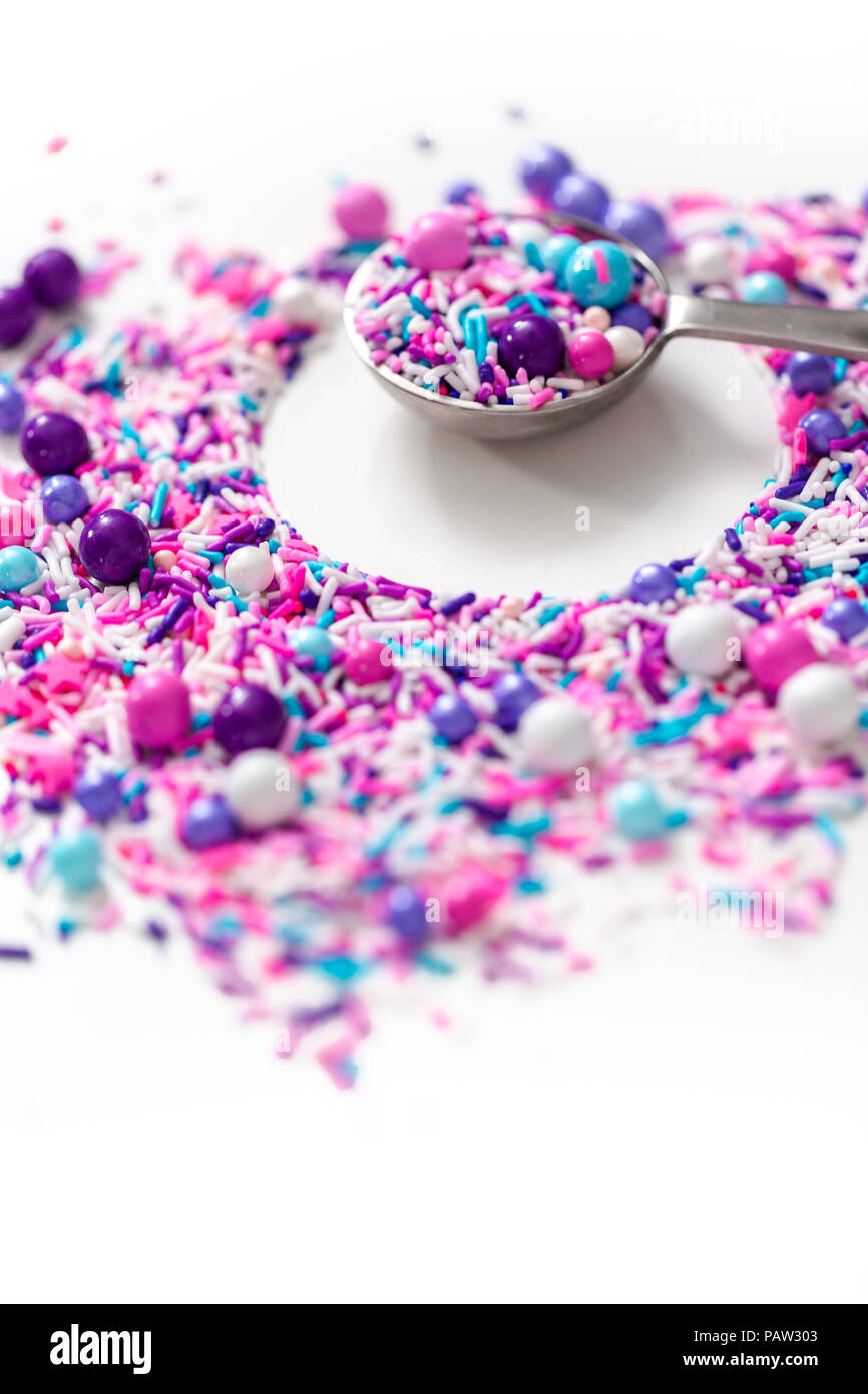Colorful purple sprinkle blend on a white background Stock Photo - Alamy