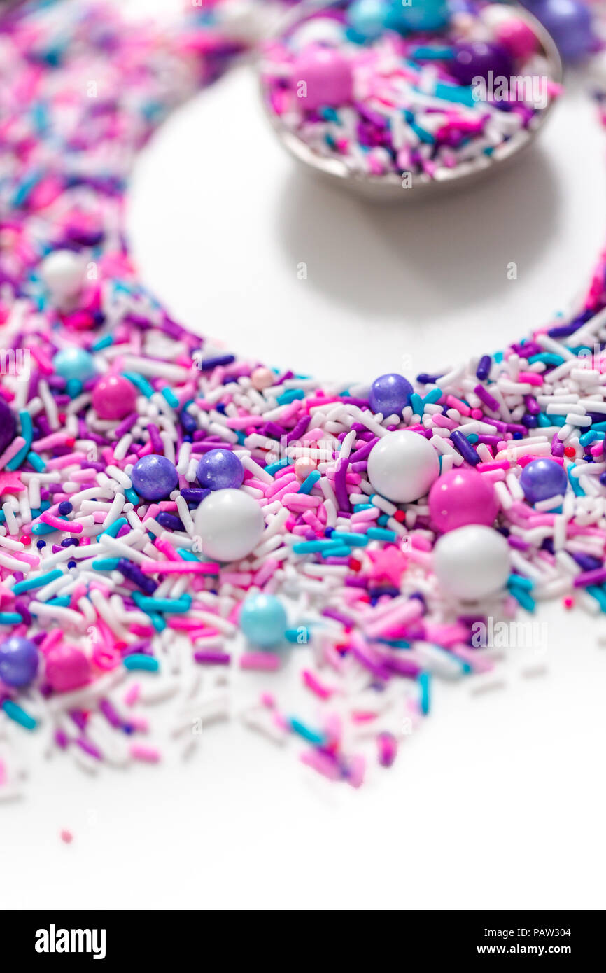 Colorful purple sprinkle blend on a white background Stock Photo - Alamy