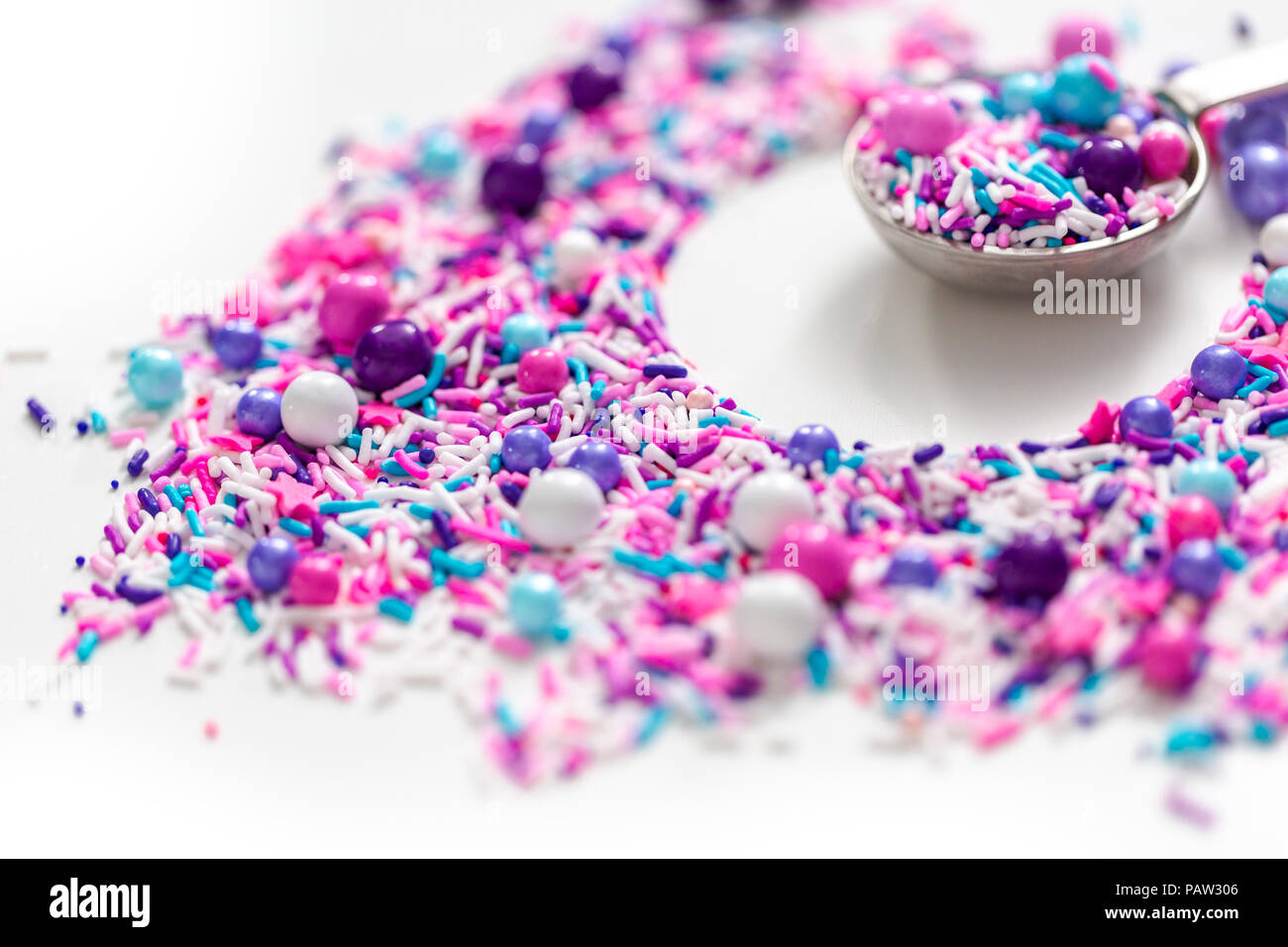 Colorful purple sprinkle blend on a white background Stock Photo - Alamy