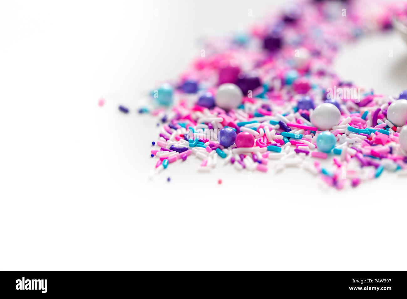 Colorful purple sprinkle blend on a white background Stock Photo - Alamy