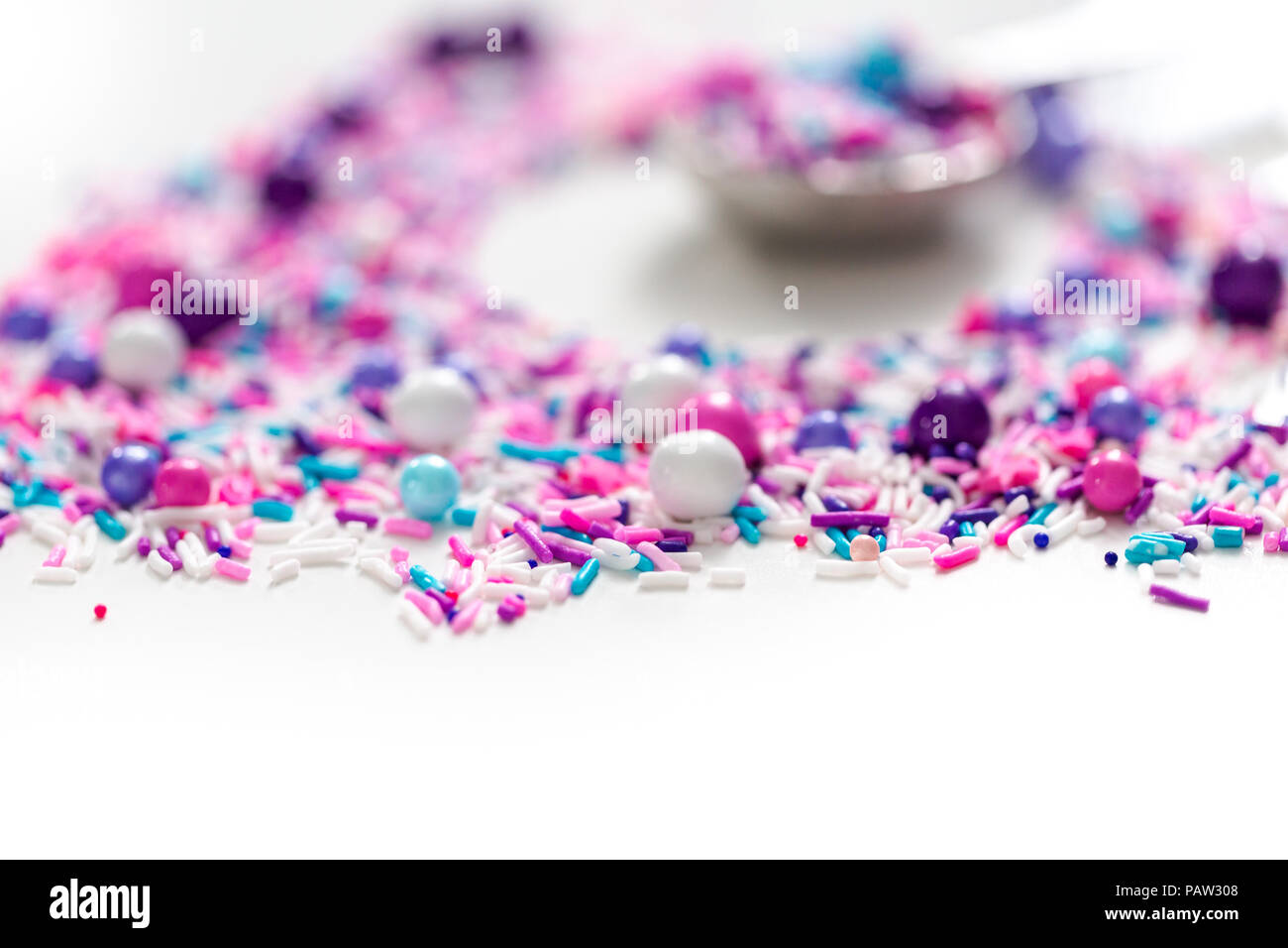 Colorful purple sprinkle blend on a white background Stock Photo - Alamy