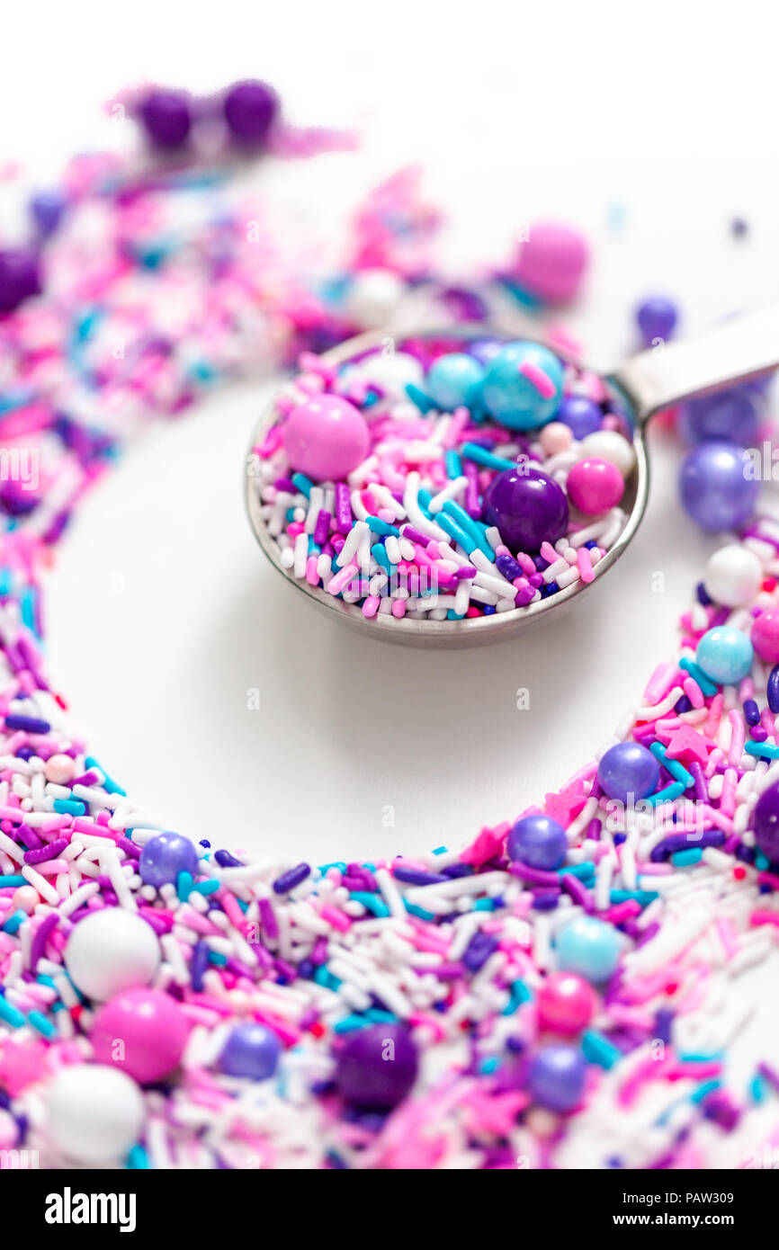 Colorful purple sprinkle blend on a white background Stock Photo - Alamy