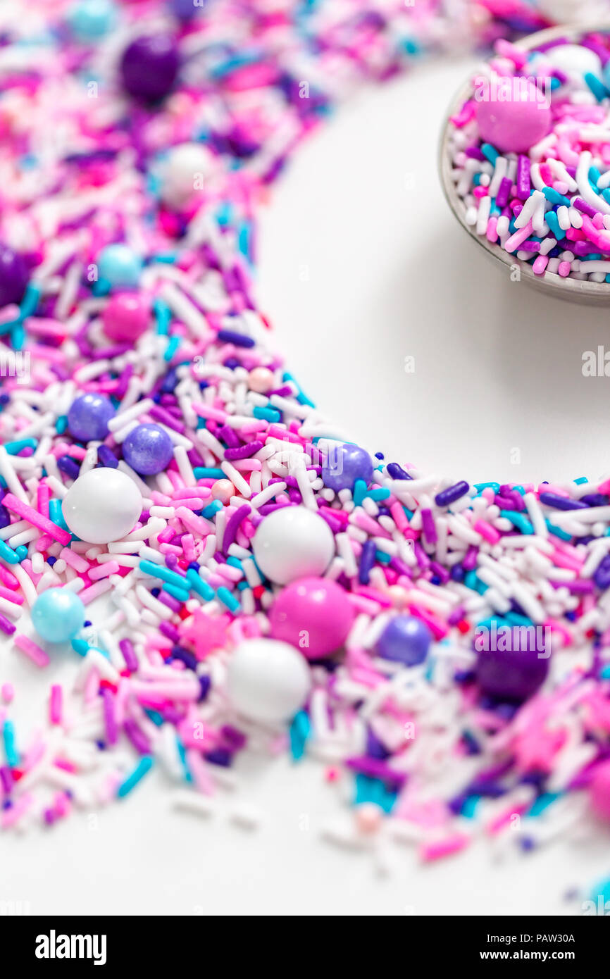 Colorful purple sprinkle blend on a white background Stock Photo - Alamy