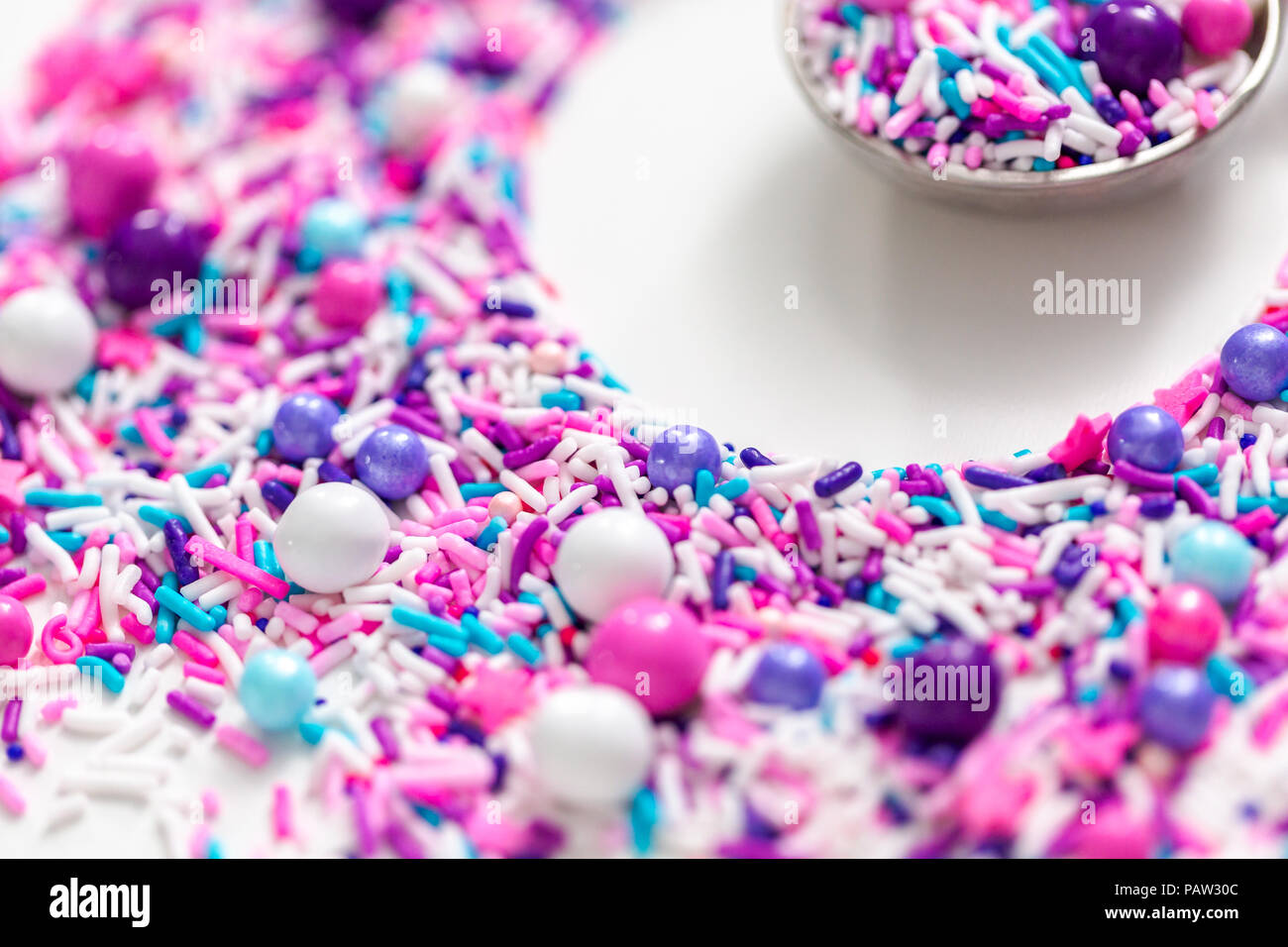 Colorful purple sprinkle blend on a white background Stock Photo - Alamy