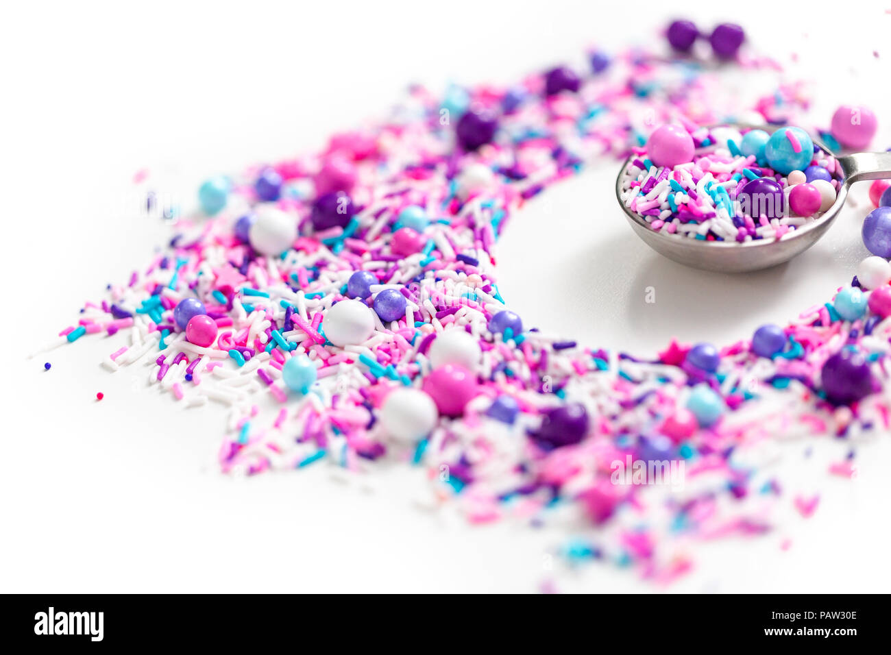 Colorful purple sprinkle blend on a white background Stock Photo - Alamy