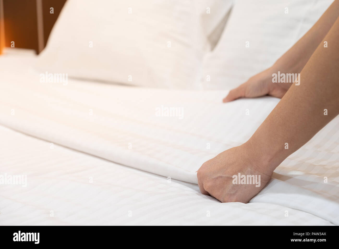 Woman changing sheets hi-res stock photography and images - Alamy