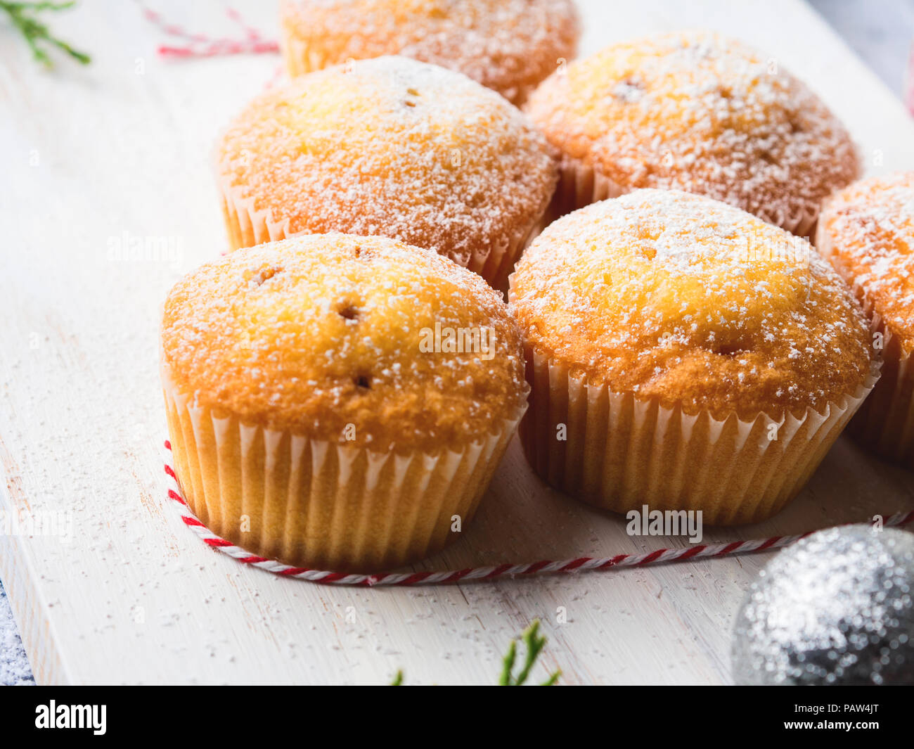 Christmas baking concept - muffins with icing sugar and festive winter ...