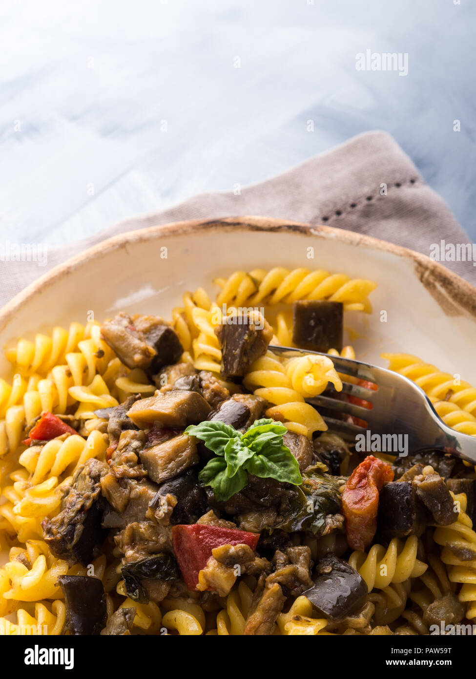 Fusilli pasta with eggplant and tomato sauce. Traditional italian dish ...