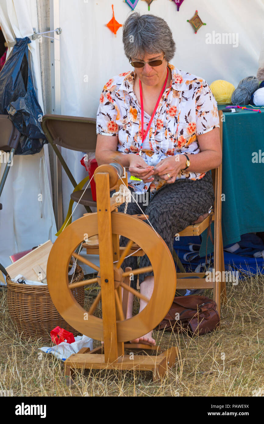 Lady spinning wool spinning wheel hi-res stock photography and images ...