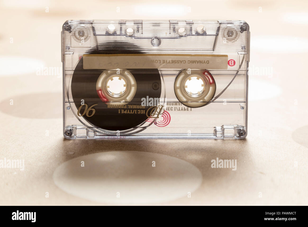 front view of a transparent cassette tape, you can see the two coils ...