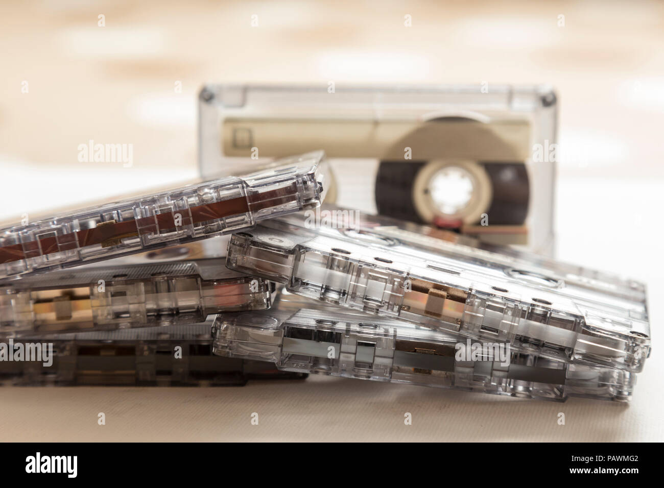 view of several old cassette tapes, some with their boxes, in a heap ...