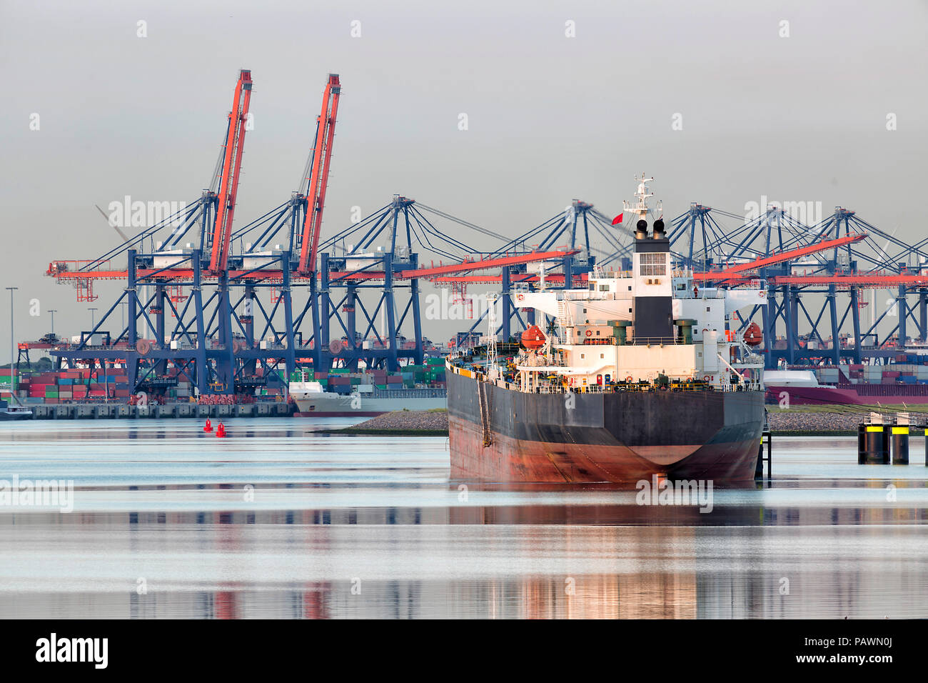 Container terminal in harbour at twilight Stock Photo - Alamy