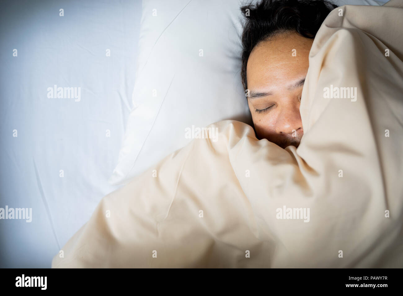 close up of an Asian man face sleeping on white bed, top view Stock ...