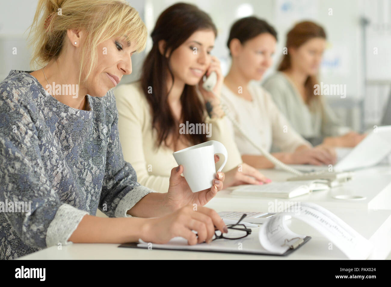 women working in office Stock Photo - Alamy