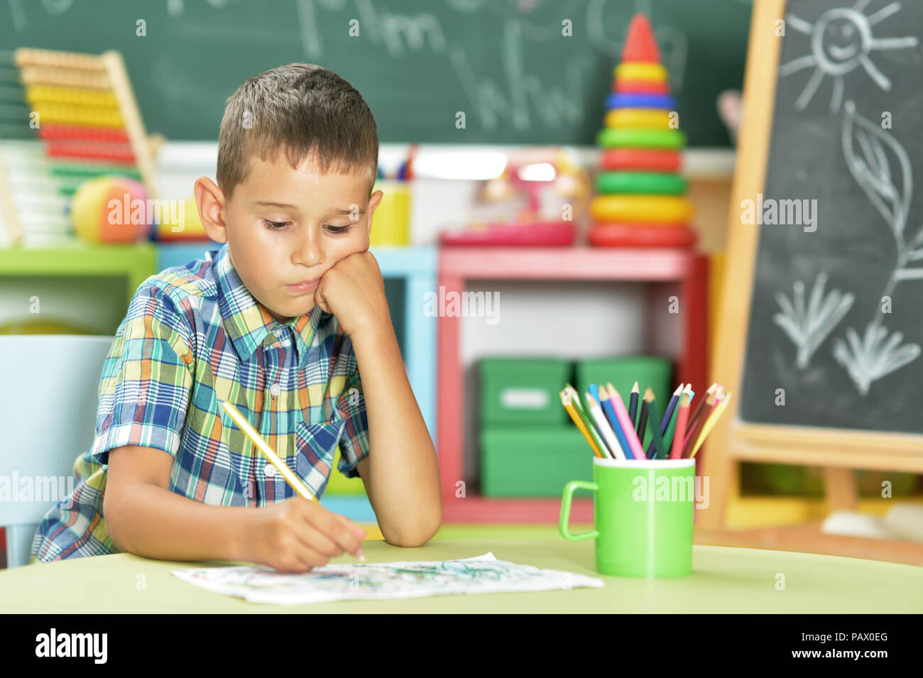 little boy drawing with pencil Stock Photo - Alamy