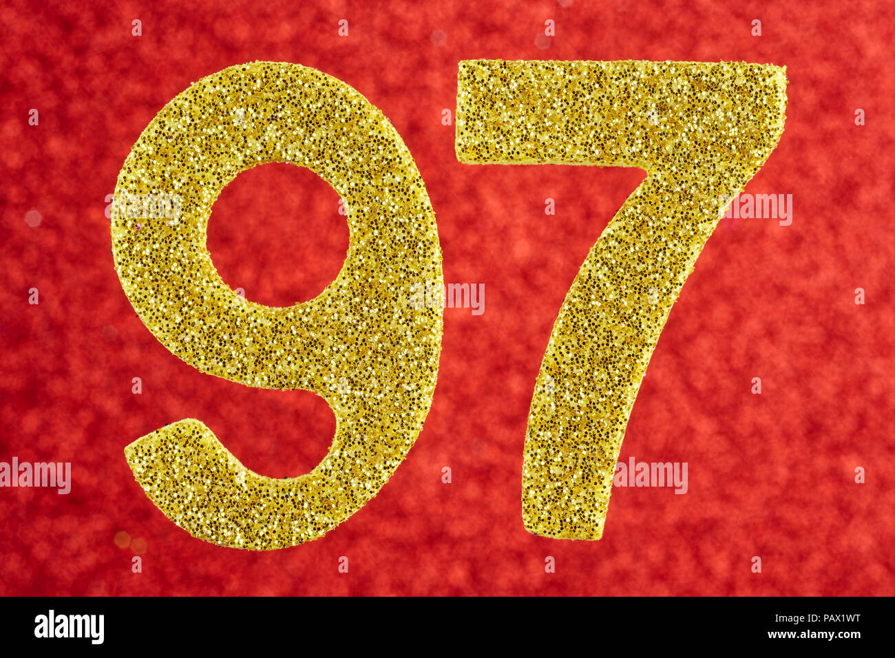 Number ninety-seven golden color over a red background. Anniversary ...