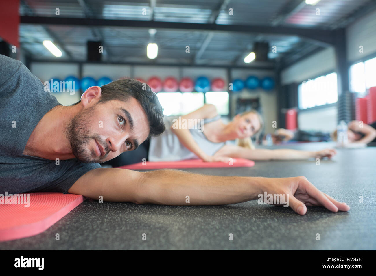 group of people doing stretching after workout Stock Photo - Alamy