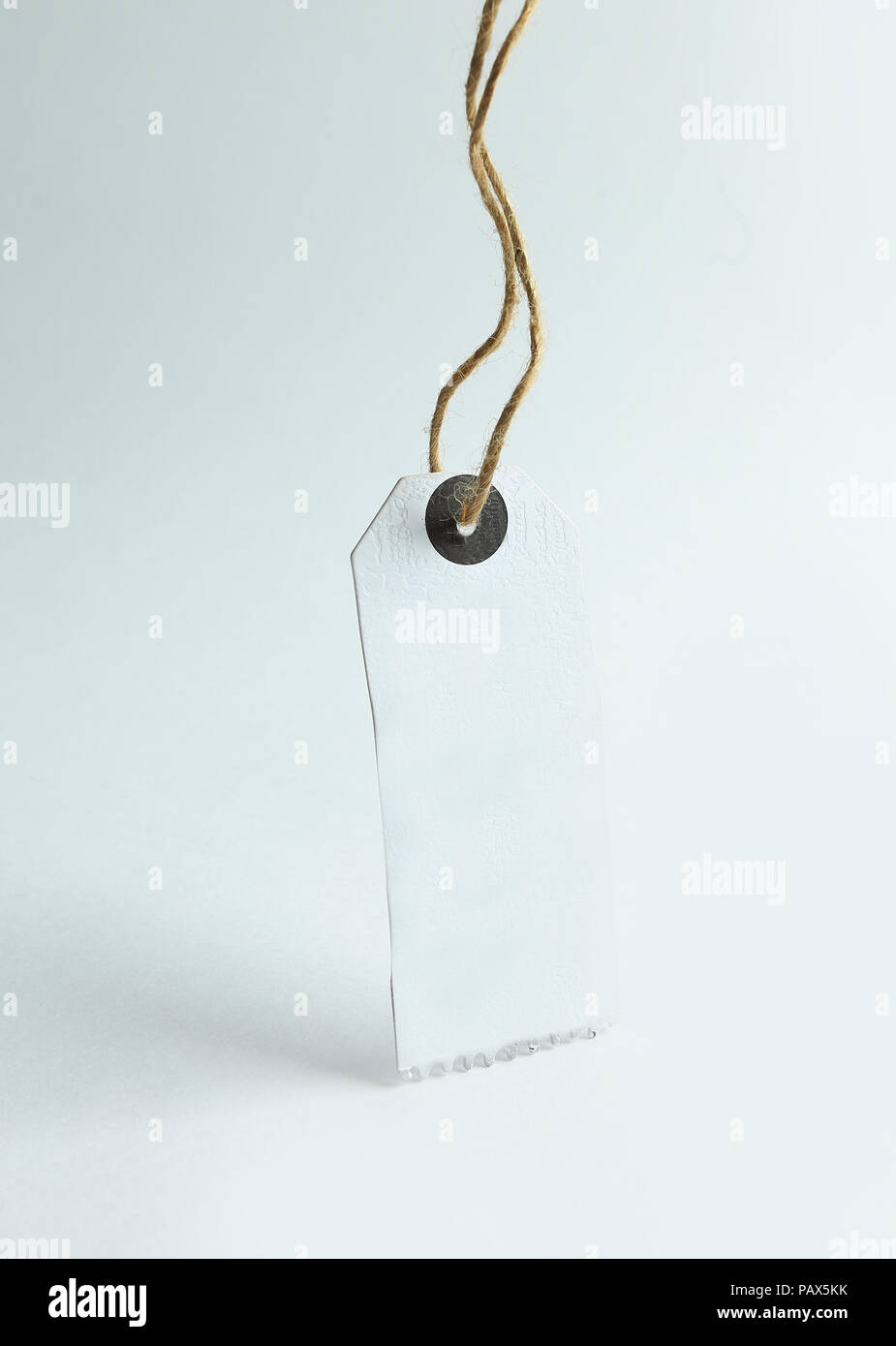 blank cardboard tag on a white background Stock Photo - Alamy