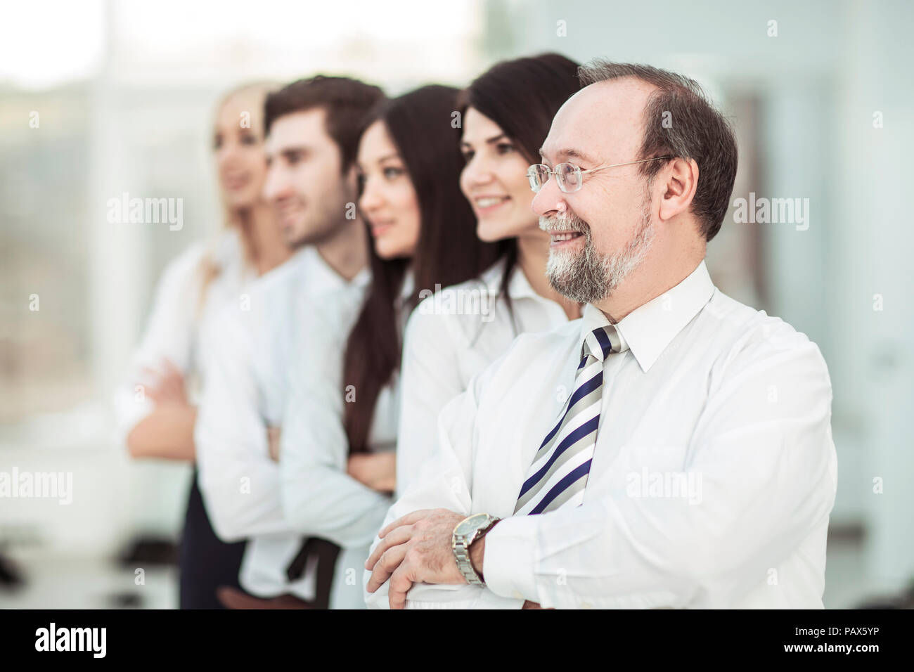 concept of team work - the leader and the business team standing one ...