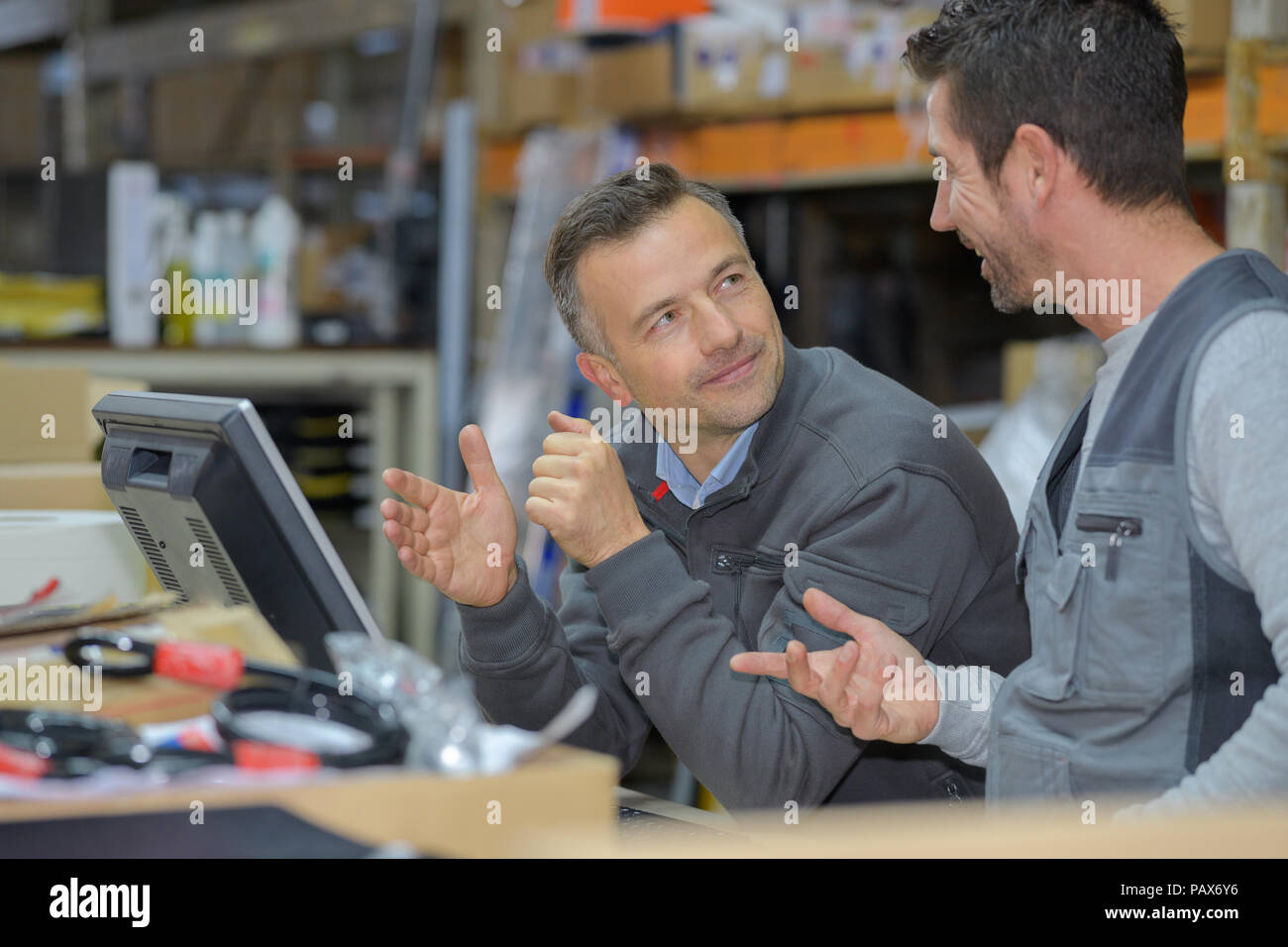 two workers workers in warehouse Stock Photo - Alamy