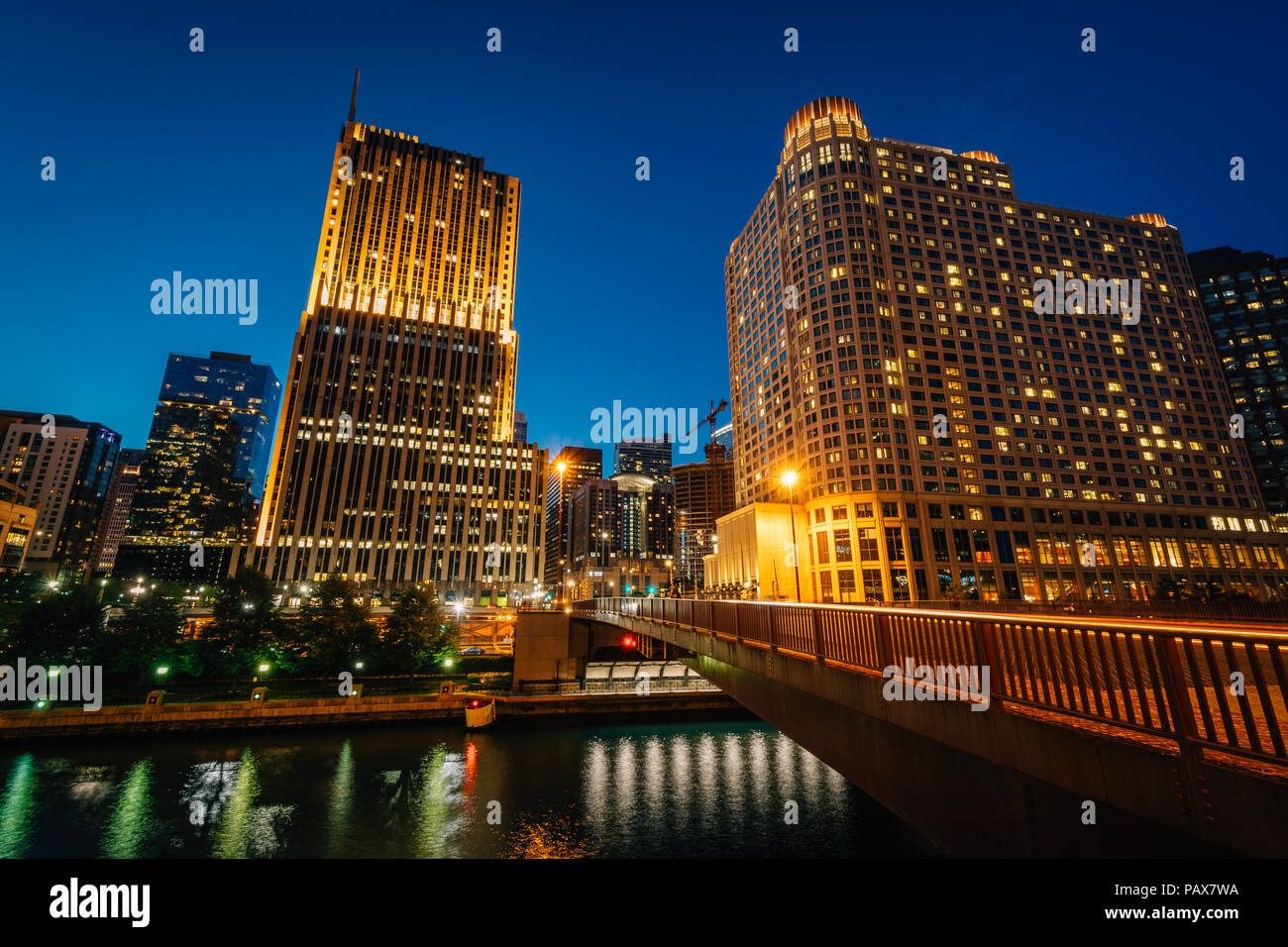 Bridge and modern buildings along the Chicago River at night, in ...