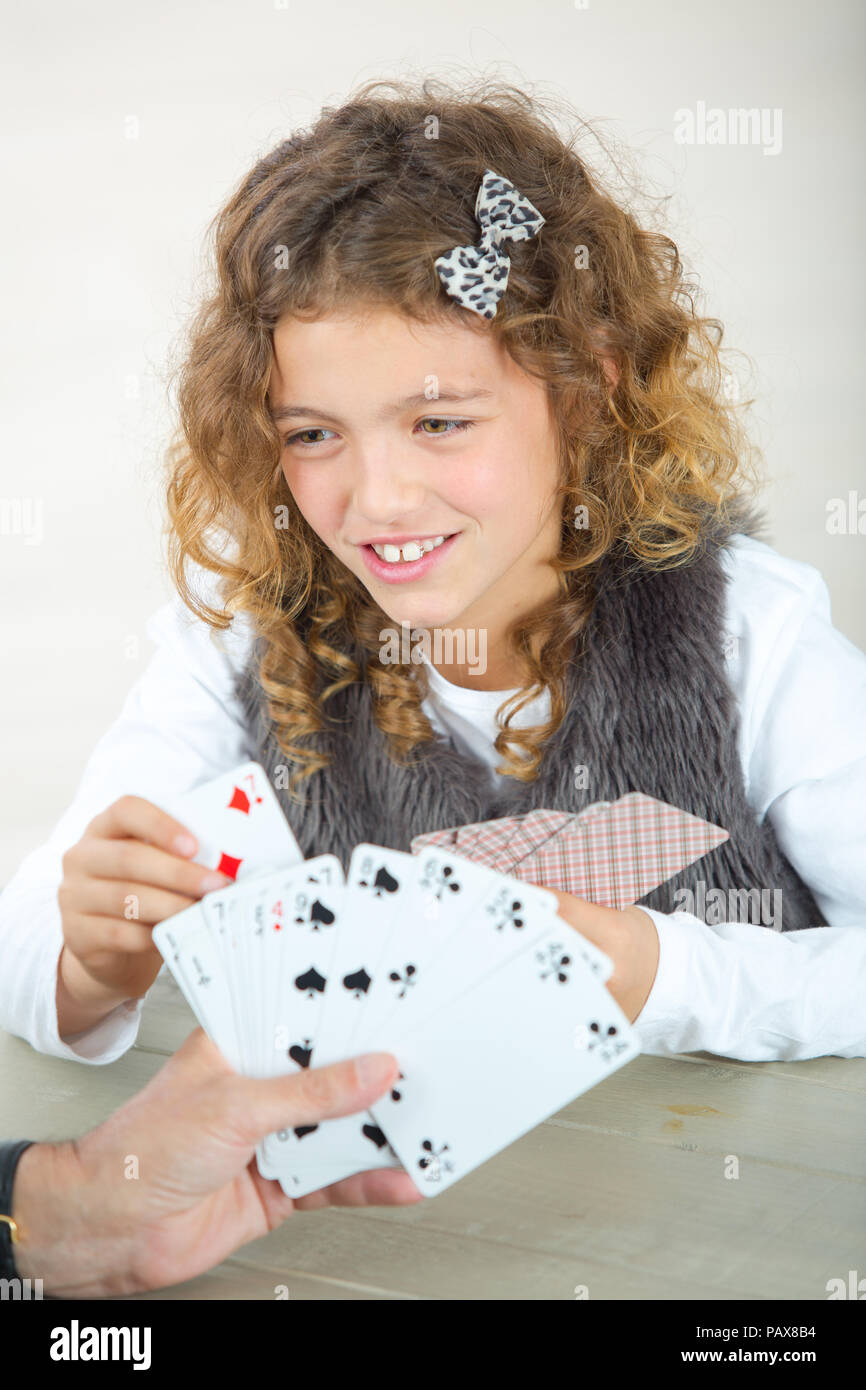 young girl playing game of cards Stock Photo - Alamy