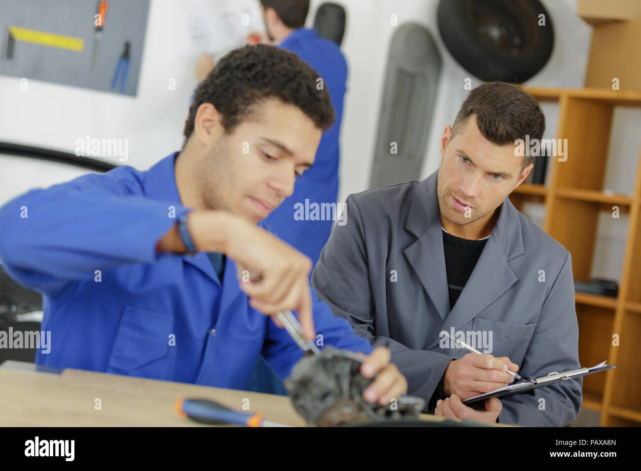 mechanic fixing the rear axle of the truck Stock Photo - Alamy