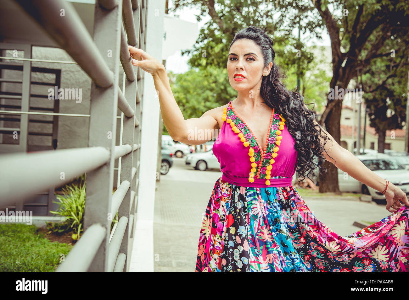 Girl modeling in street with colorfull dress Stock Photo - Alamy