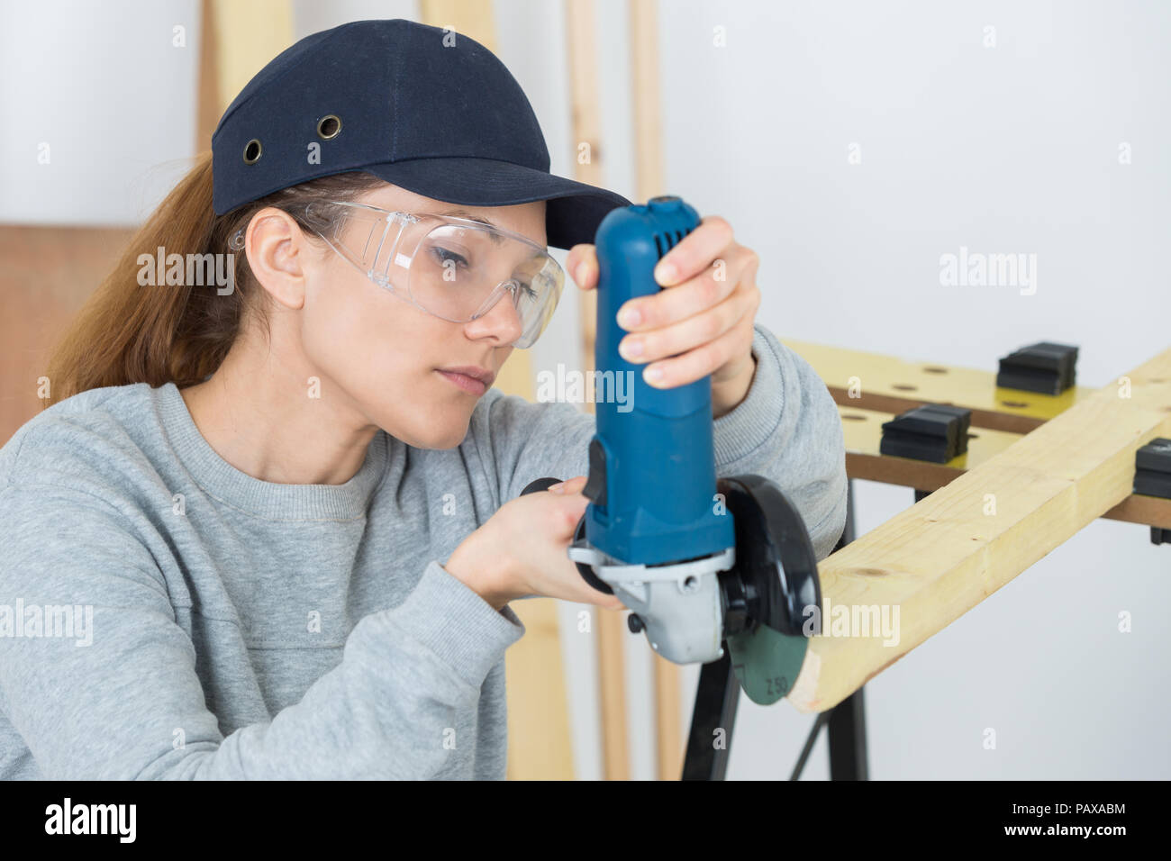 Woman wood work angle grinder hi-res stock photography and images - Alamy