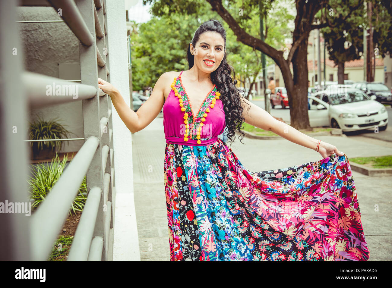 Girl modeling in street with colorfull dress Stock Photo - Alamy